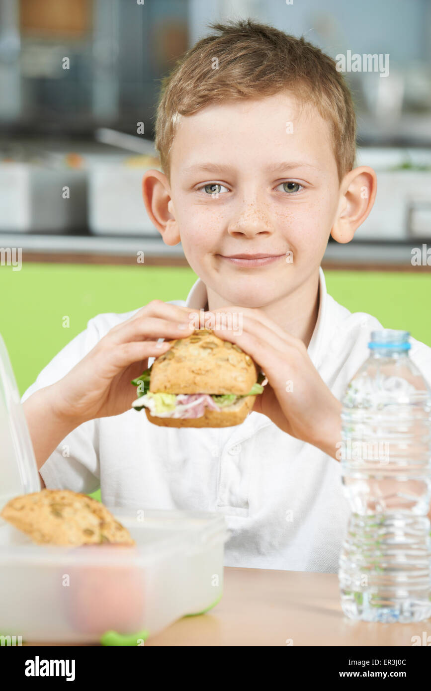 Pupil Sitting In School Cafeteria Eating Healthy Packed Lunch Stock ...