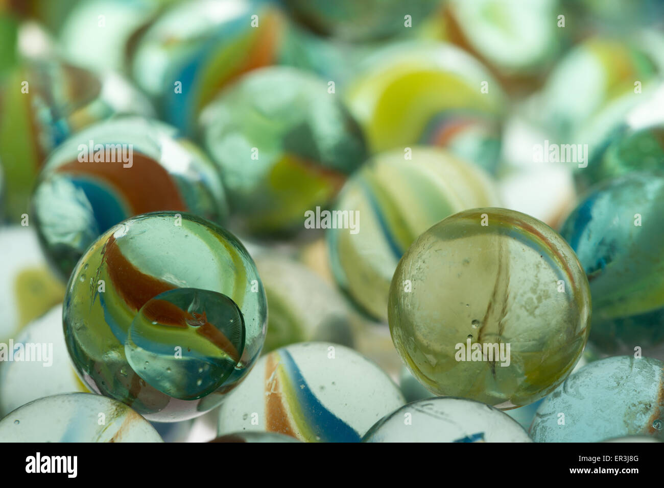 collection of old glass transparent marbles with unique swirls of ...