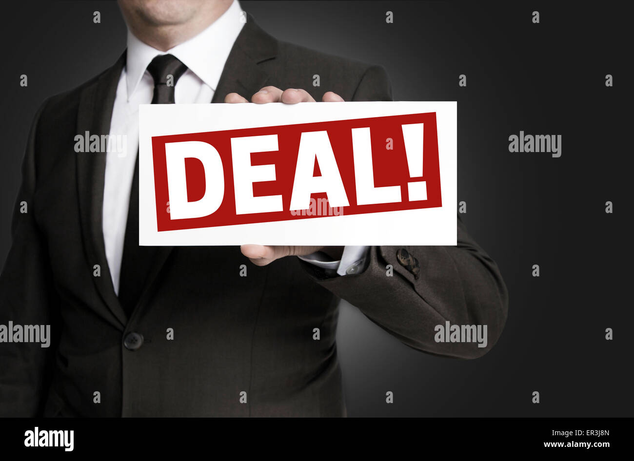 Deal sign is held by businessman Stock Photo - Alamy