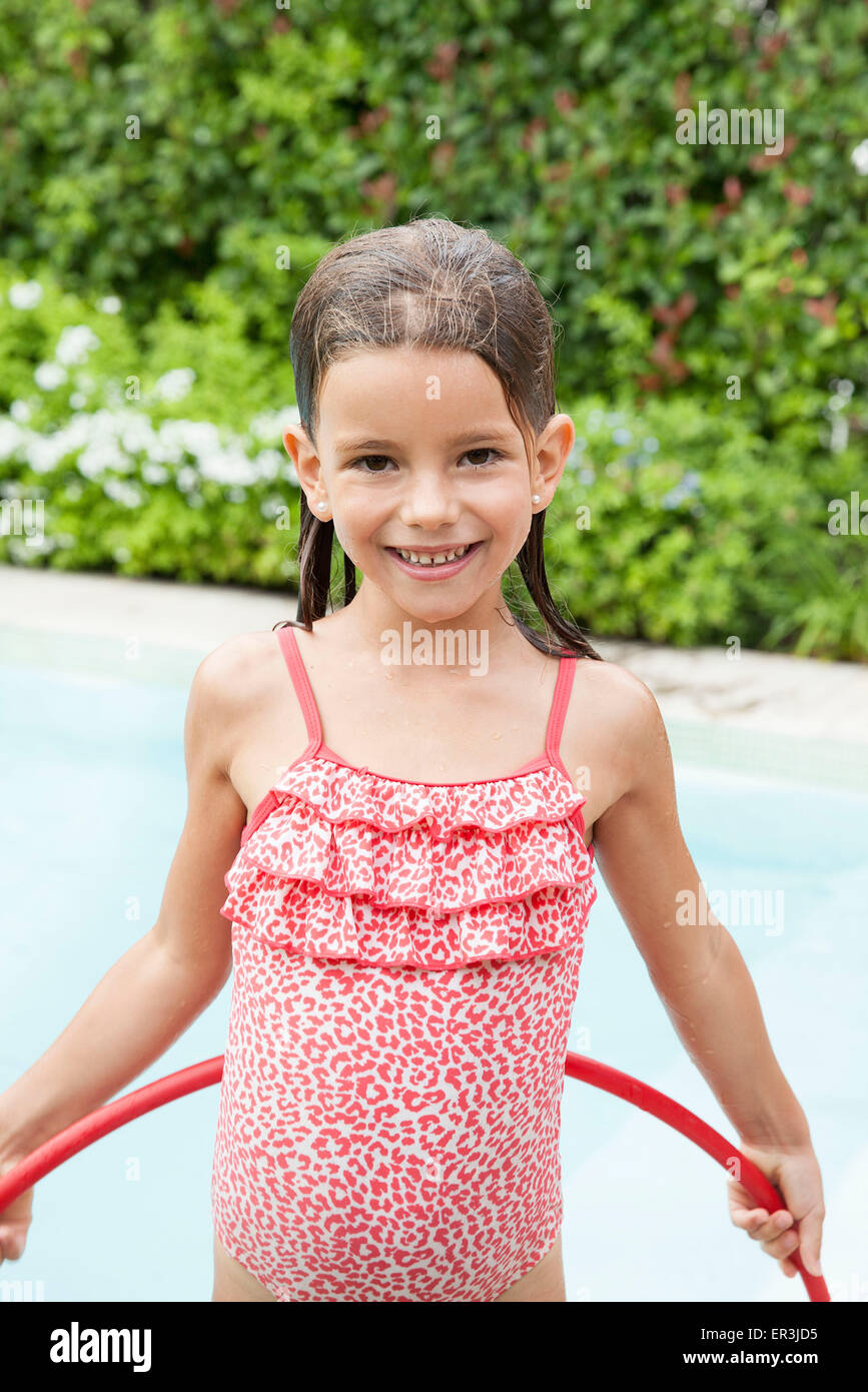 Little girl playing in pool, portrait Stock Photo - Alamy