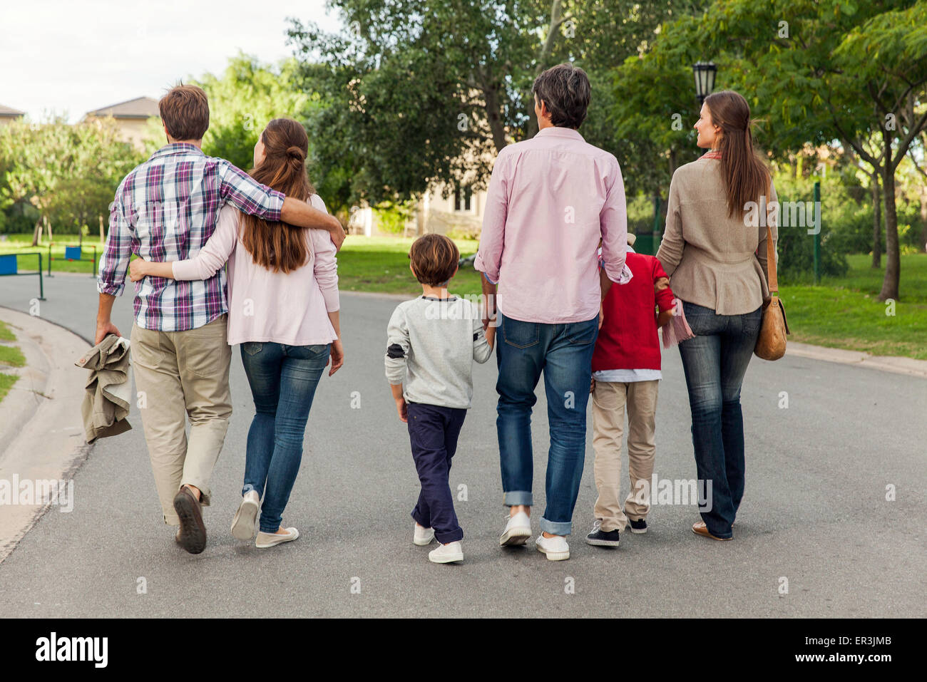 Family Walking Together From Behind