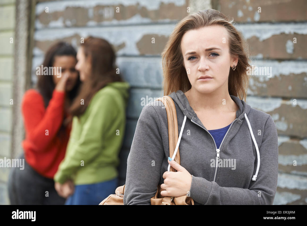 Unhappy Teenage Girl Being Gossiped About By Peers Stock Photo - Alamy