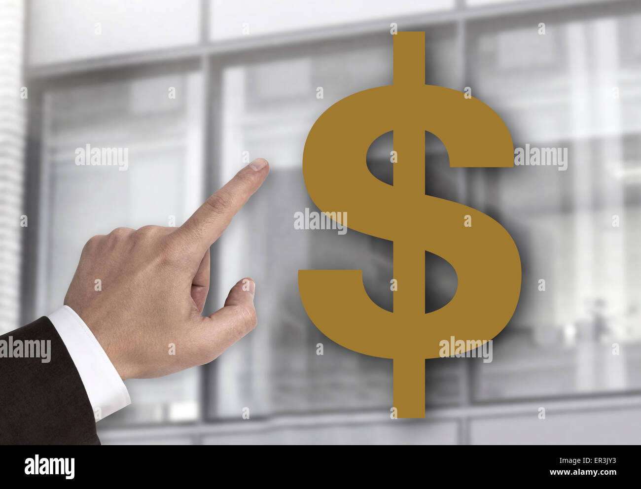 Hand pointing at dollar sign concept Stock Photo - Alamy