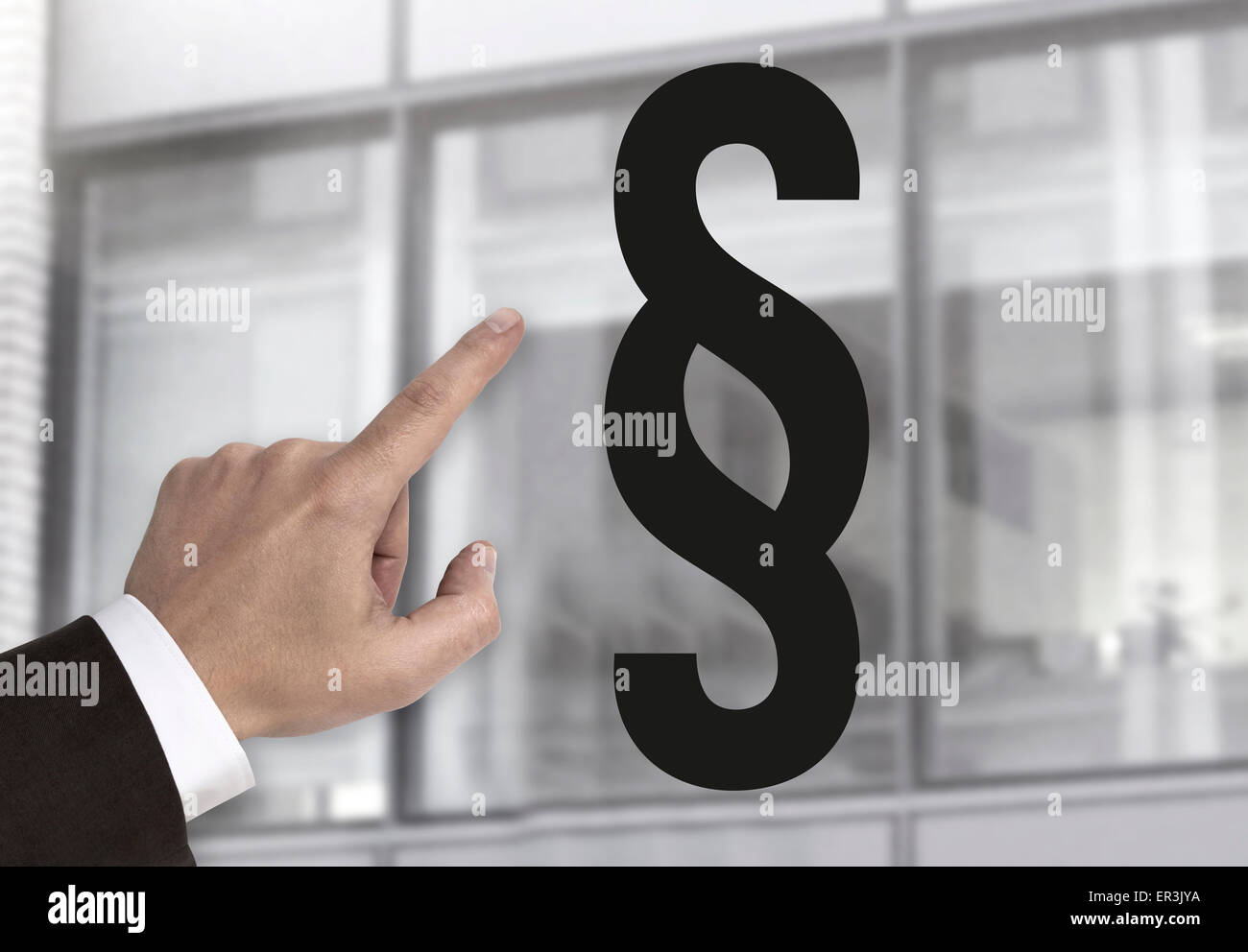 Hand pointing at paragraph sign concept Stock Photo - Alamy