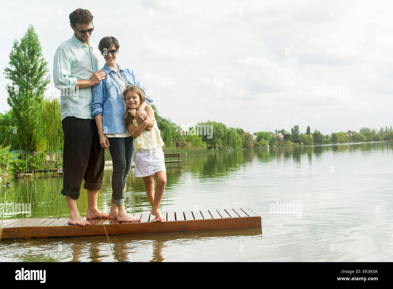 Family standing on dock, portrait Stock Photo - Alamy
