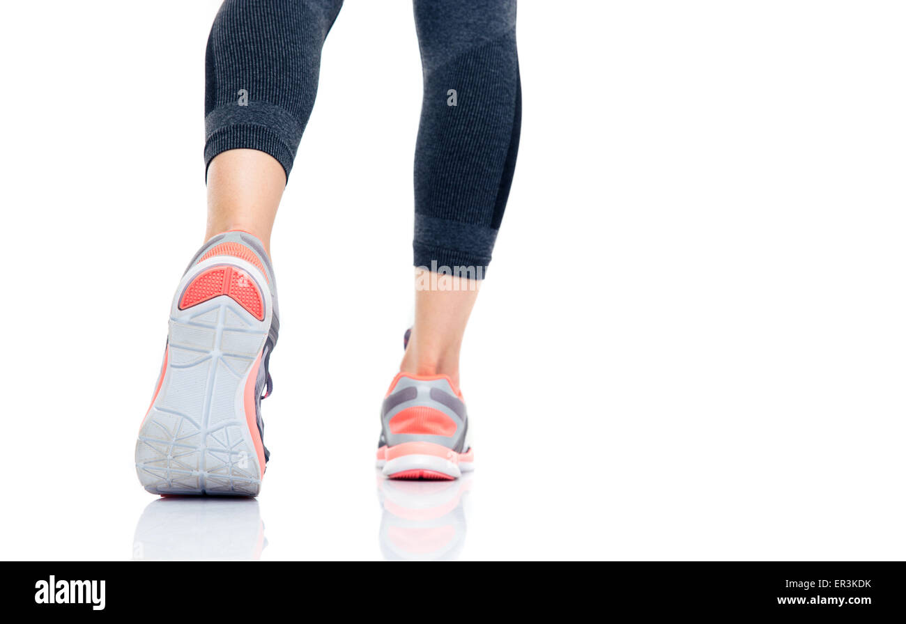Closeup image of a legs going to run isolated on a white background ...