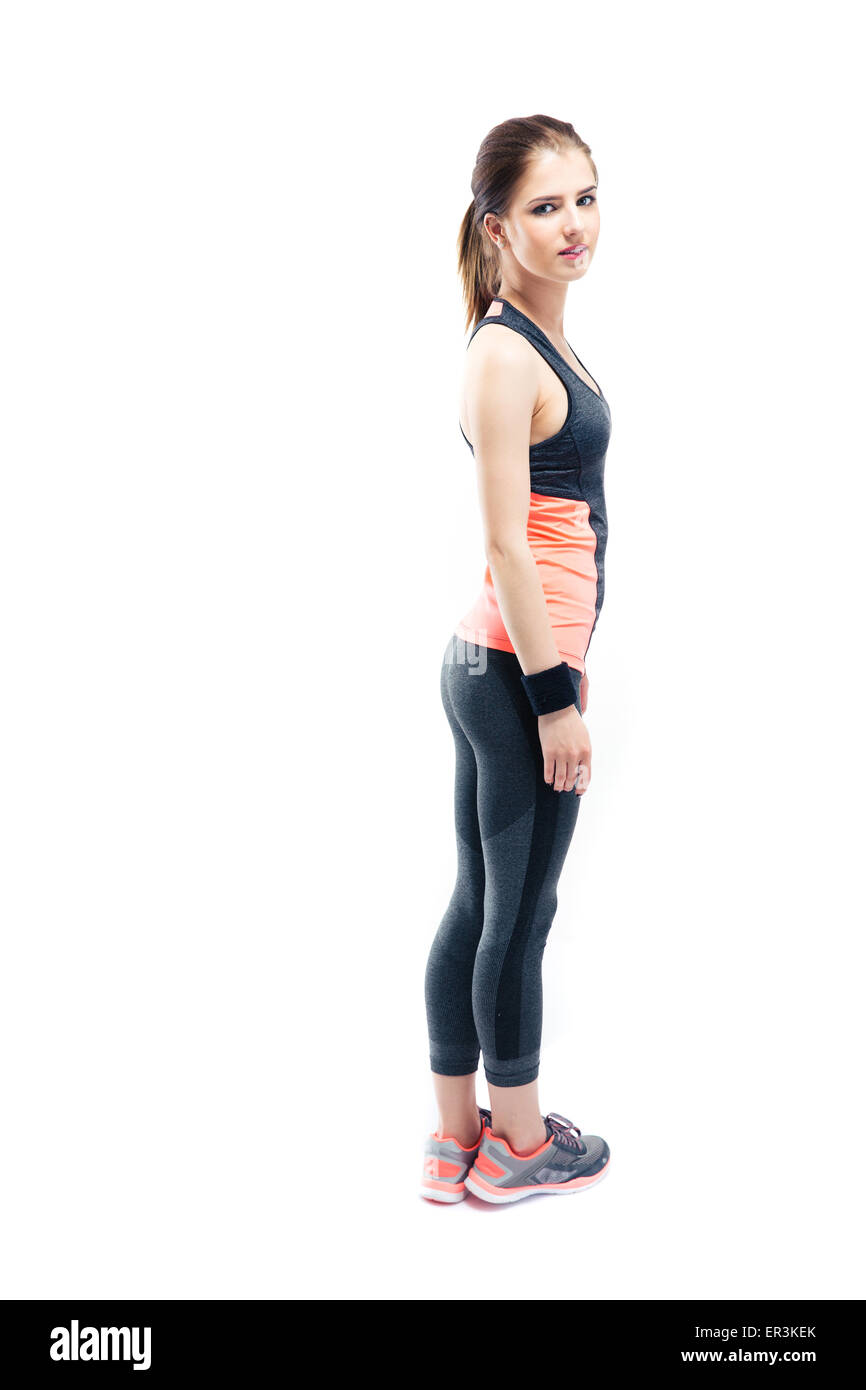 Full length portrait of a fitness woman standing isolated on a white ...