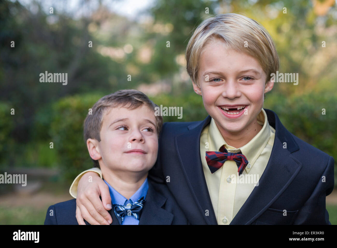 LOS ANGELES, CA – NOVEMBER 11: Young boys dressed in suit’s and bow tie ...
