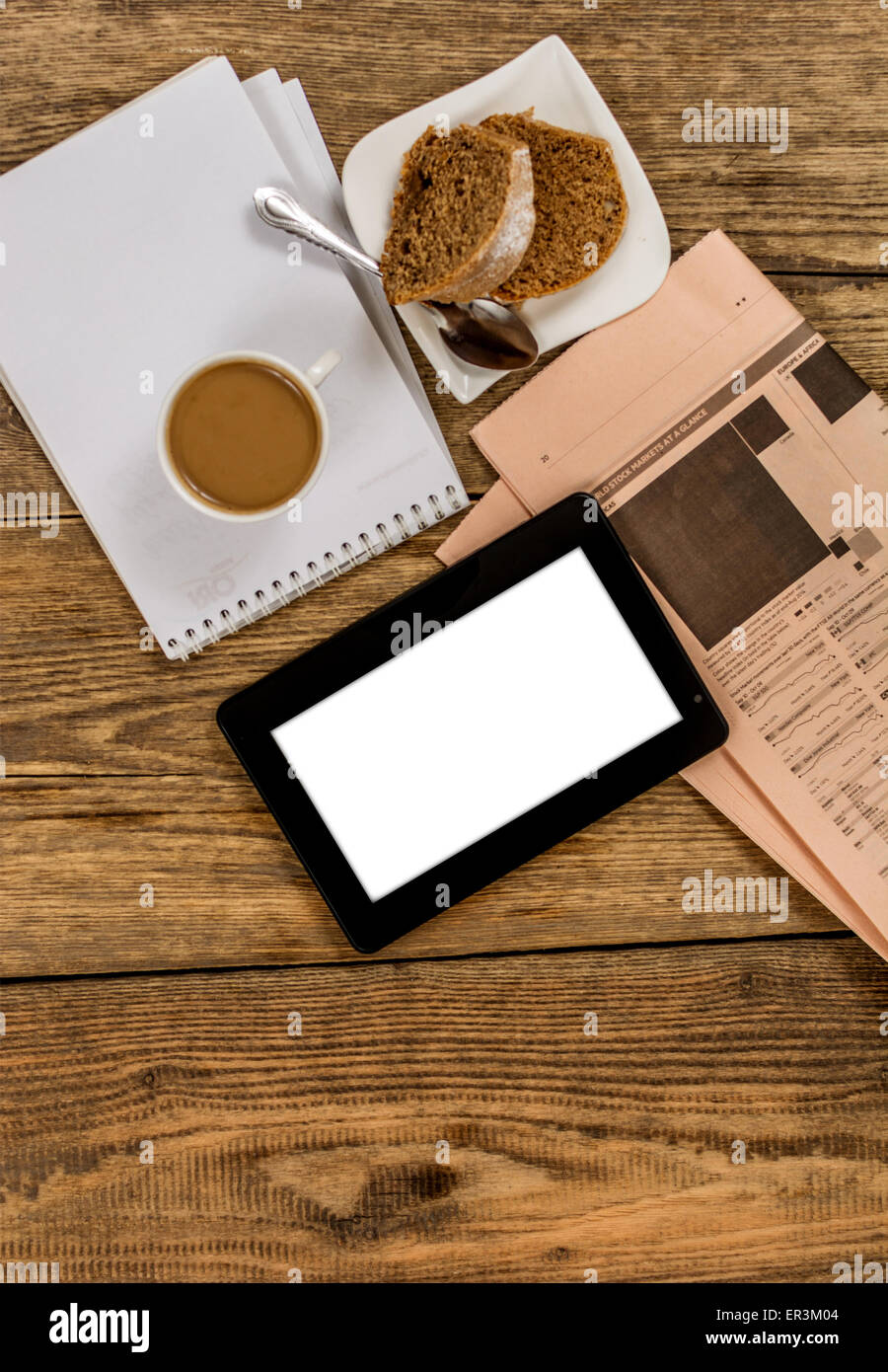 Office background with laptop coffee tablet dessert notepad newspaper ...