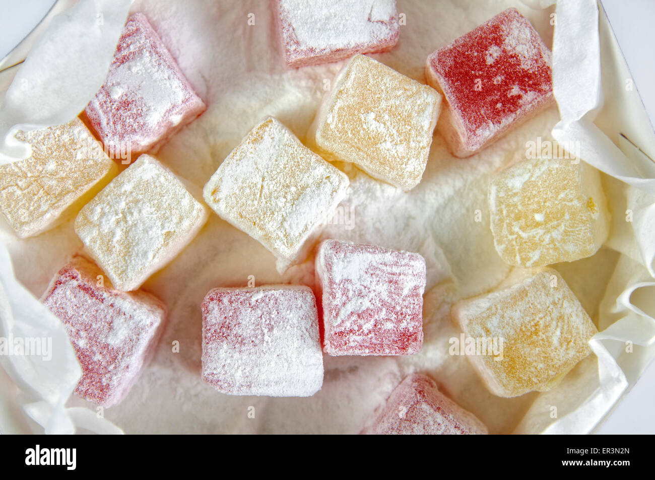 Looking down on an open box of rose and lemon turkish delight Stock ...