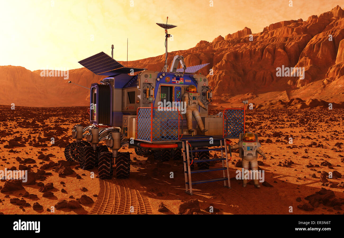 A manned rover pauses in a martian canyon while an explorer in a ...