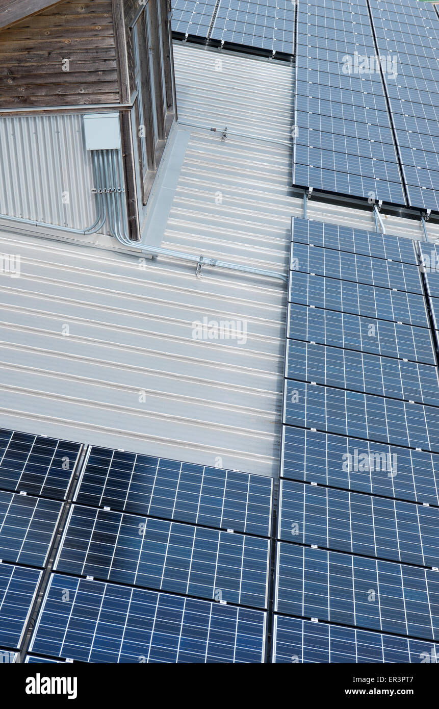 photovoltaic solar panels atop galvalume roof and dormer window of ...