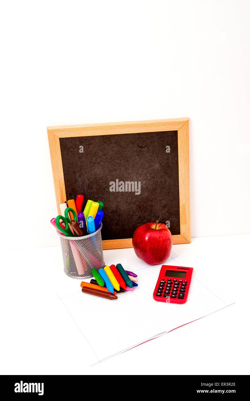 Doing homework with crayons and calculator Stock Photo - Alamy