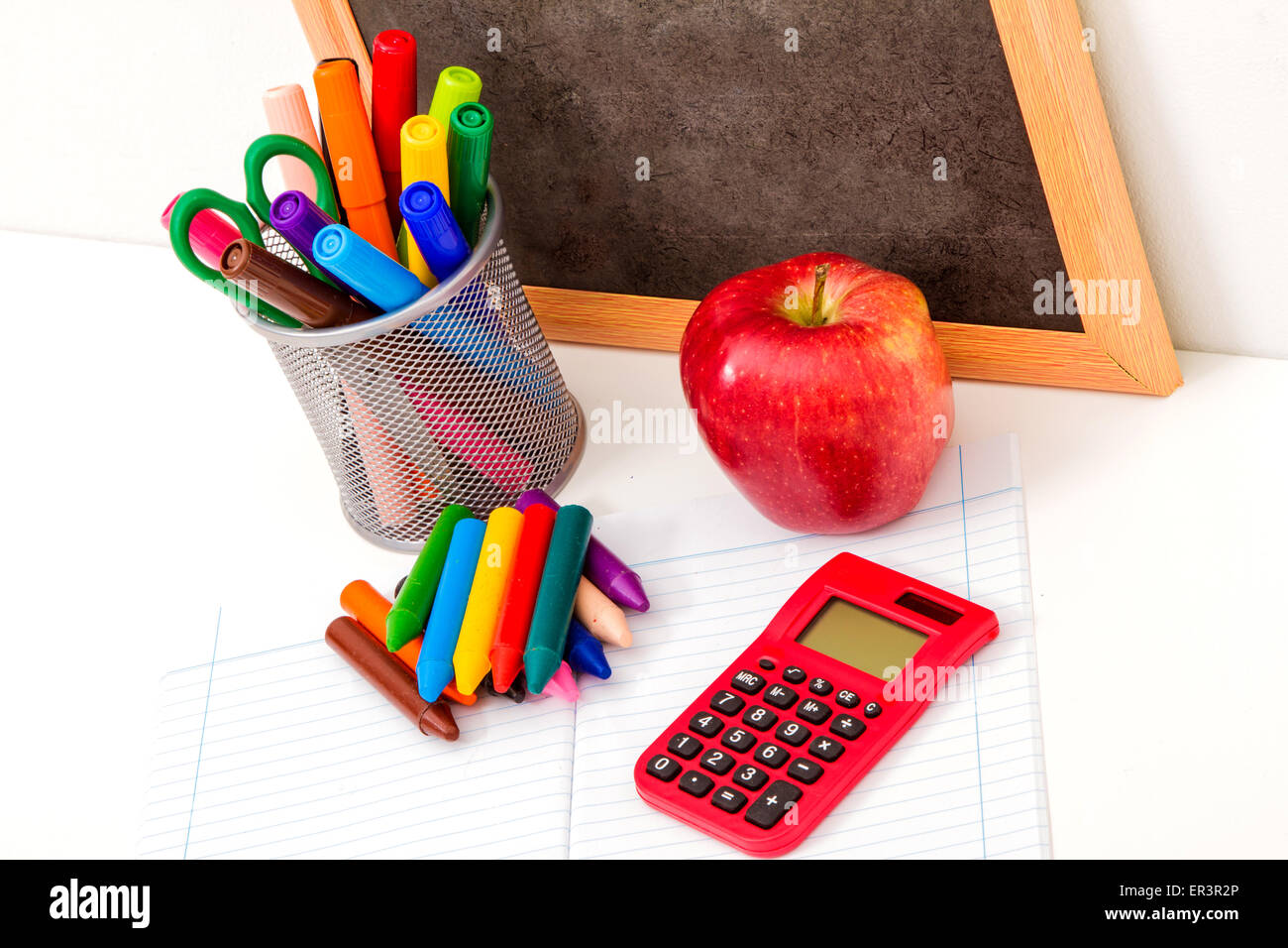 Doing homework with crayons and calculator Stock Photo - Alamy