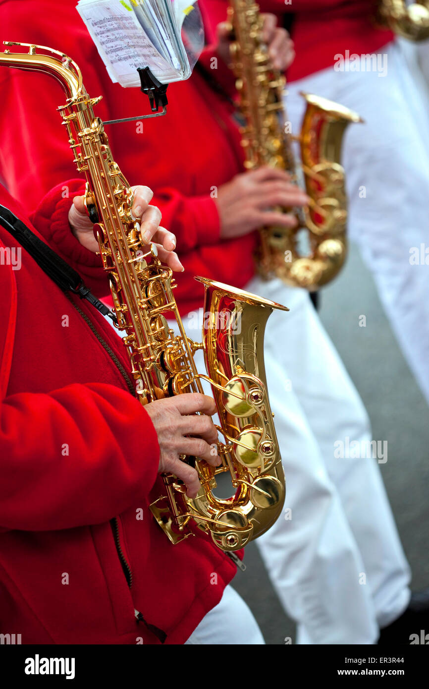 Saxophonists and instruments playing in a marching band Stock Photo - Alamy