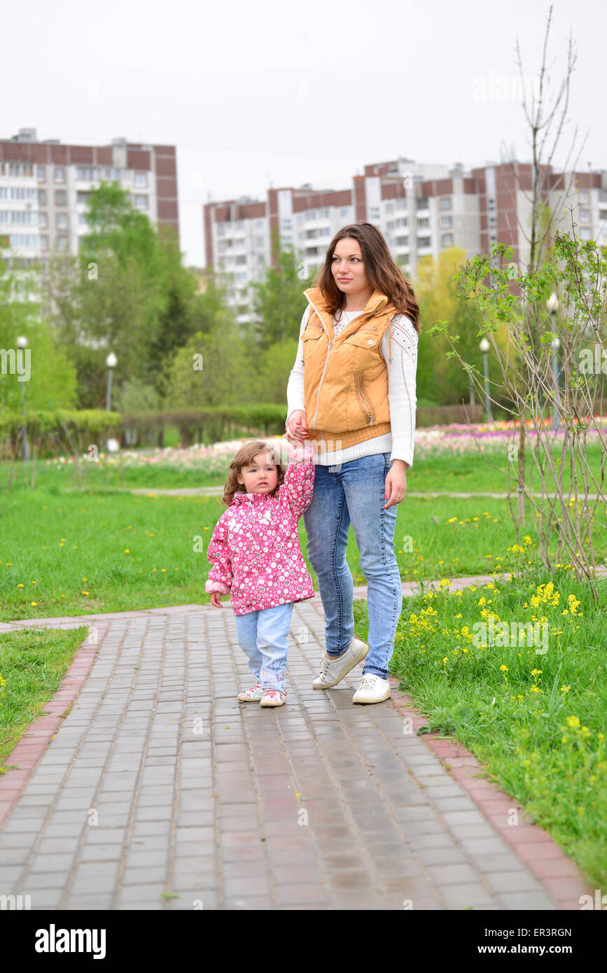 Mother And a Daughter Walking Along Path Stock Photo - Alamy