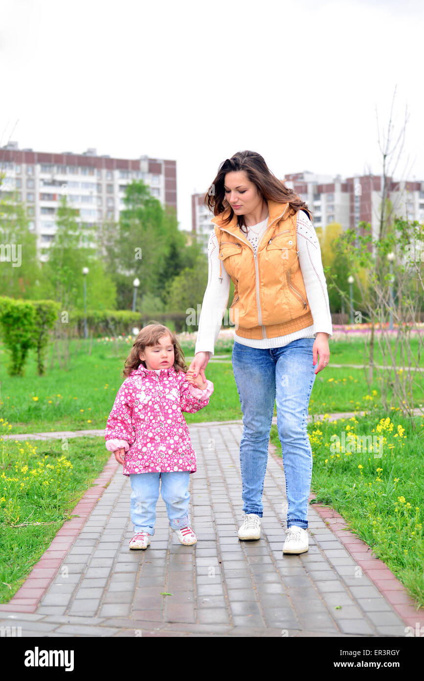 Mother And a Daughter Walking Along Path Stock Photo - Alamy