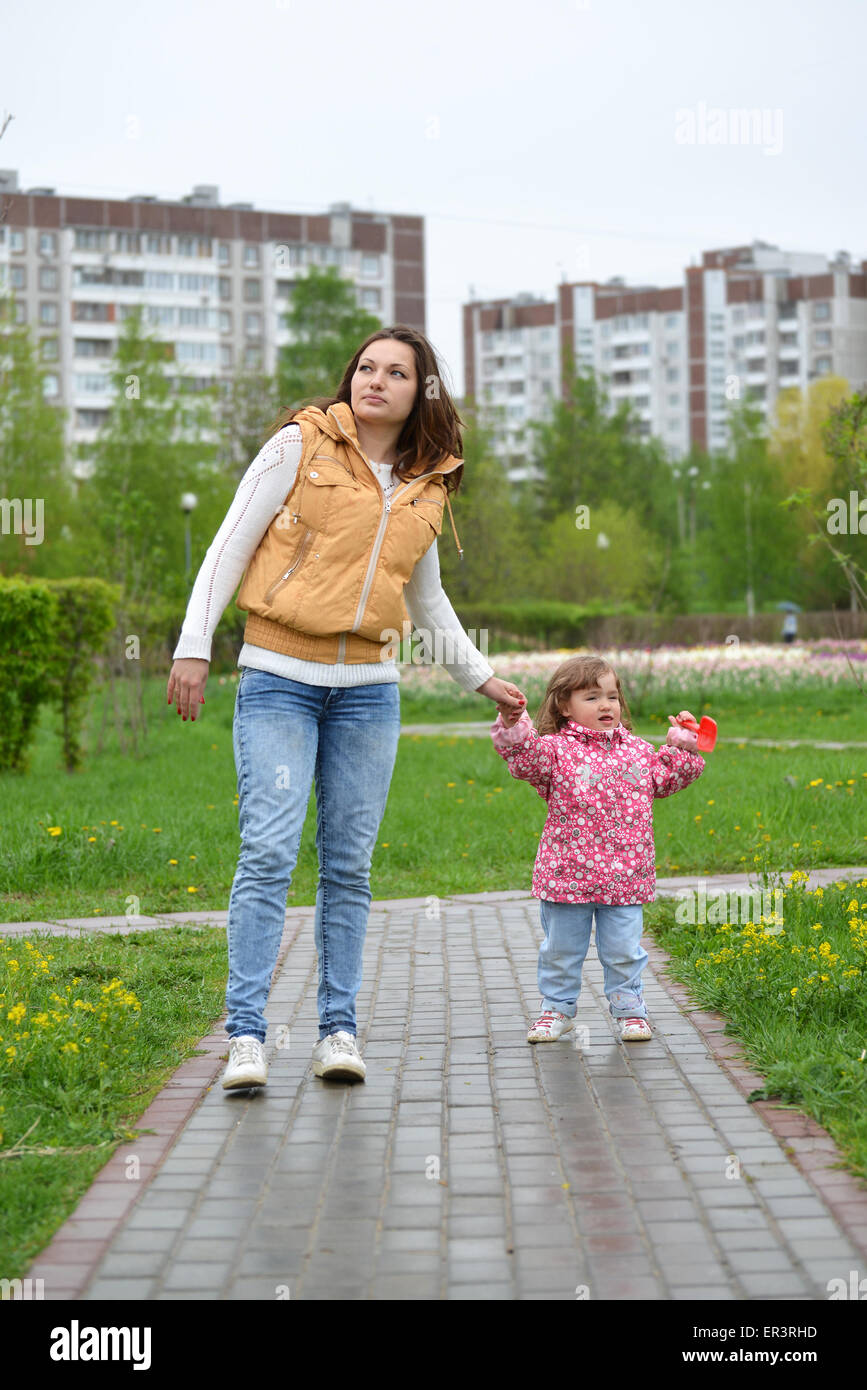 Mother And a Daughter Walking Along Path Stock Photo - Alamy