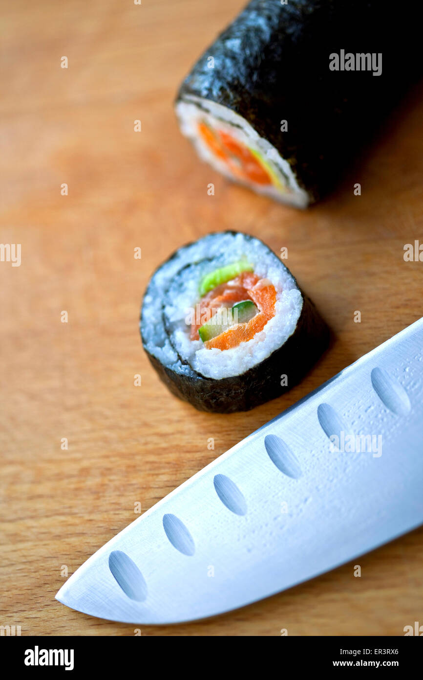 Maki and Japanese knife in the kitchen of a restaurant Stock Photo - Alamy