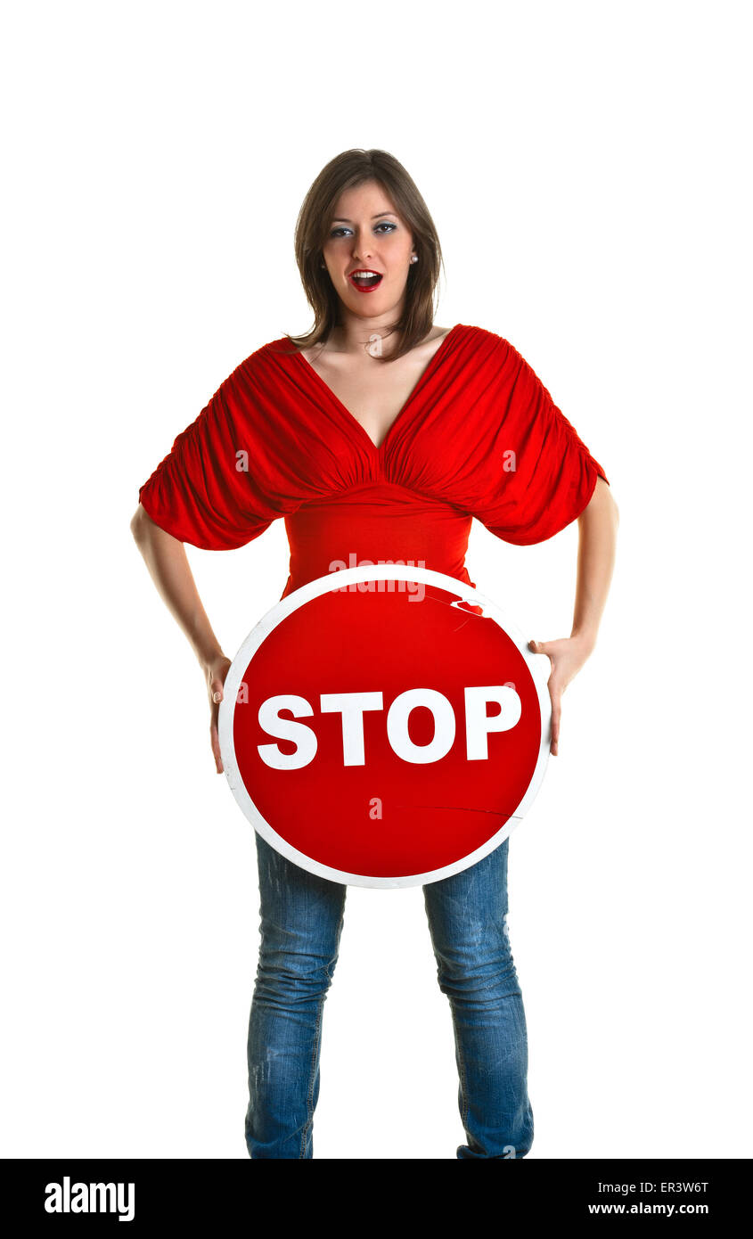 Beautiful young woman with red top and jeans holding a stop sign Stock ...