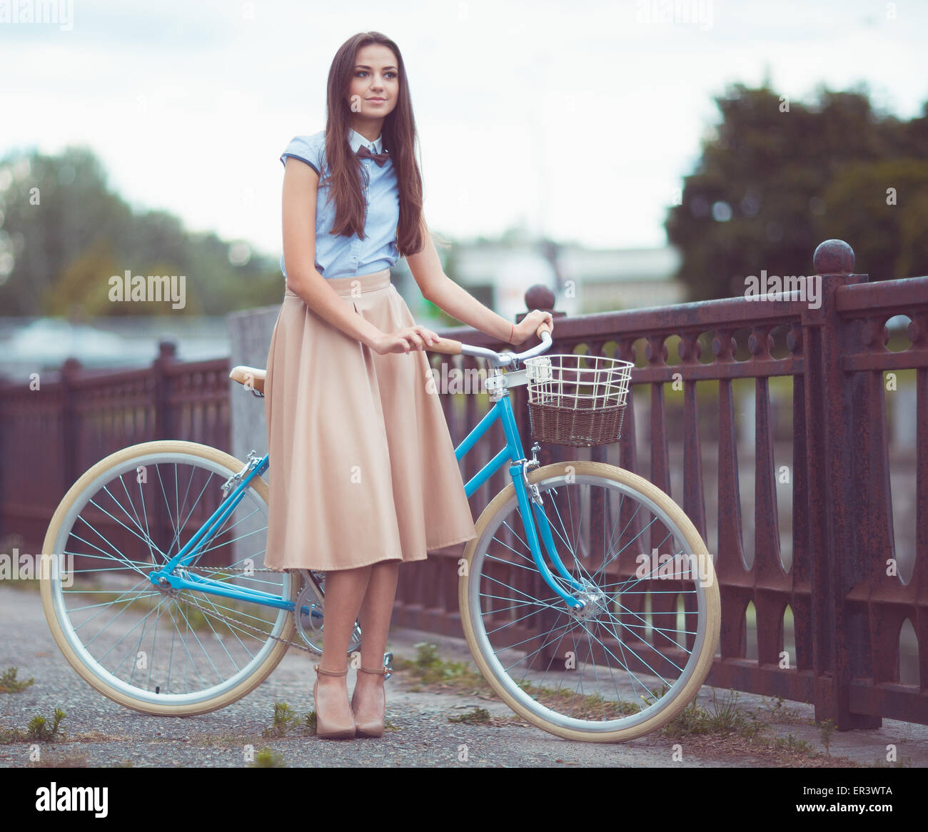 Young beautiful, elegantly dressed woman with bicycle. Beauty, fashion ...