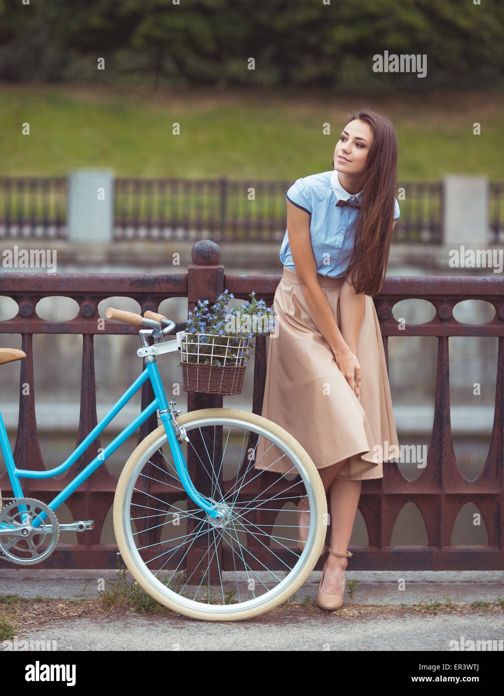 Young beautiful, elegantly dressed woman with bicycle. Beauty, fashion ...