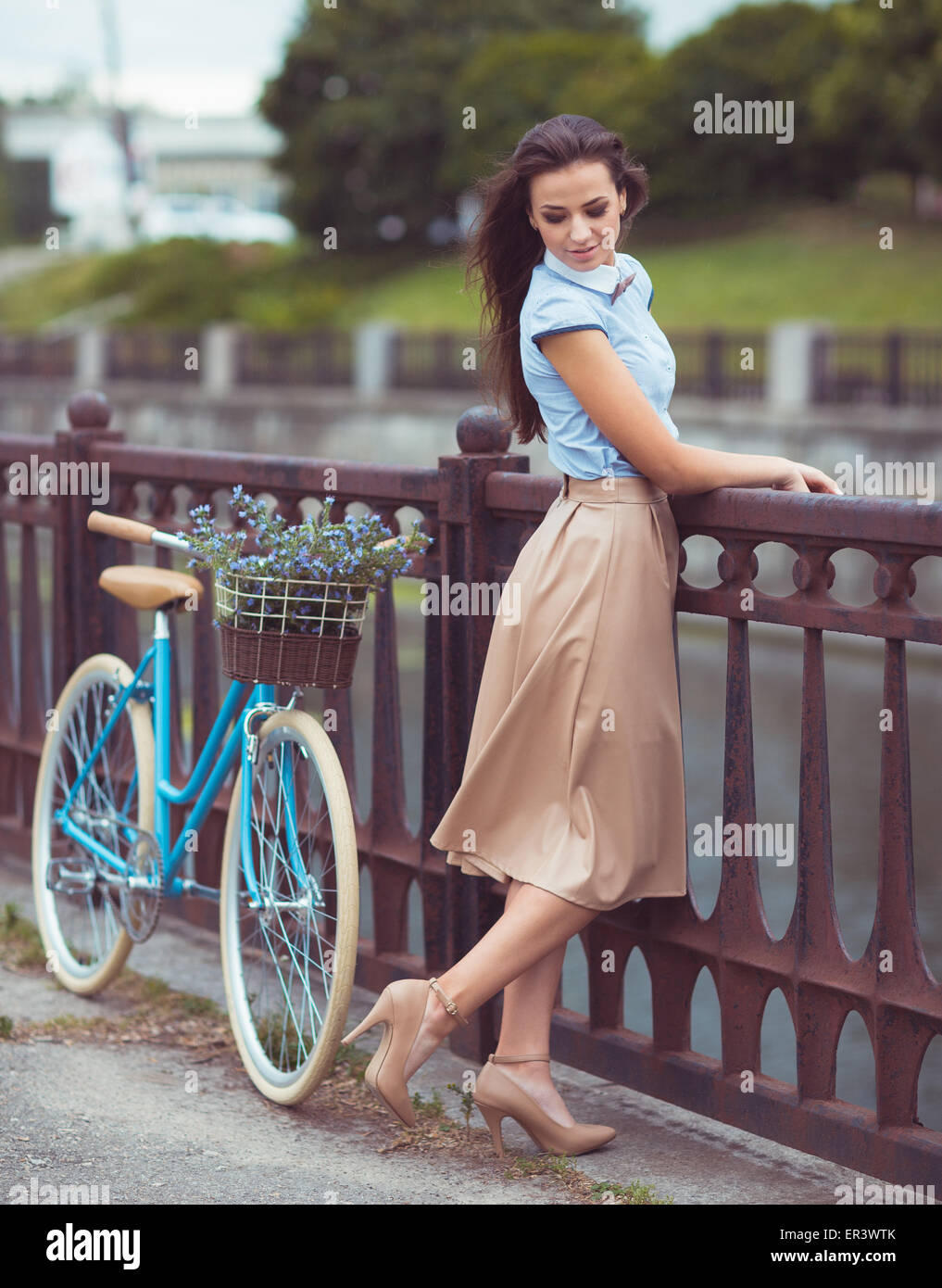 Young beautiful, elegantly dressed woman with bicycle. Beauty, fashion ...