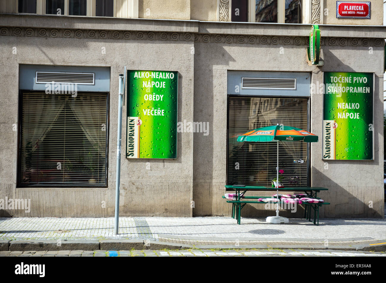 Prague street restaurant with table and chairs front door, Czech ...