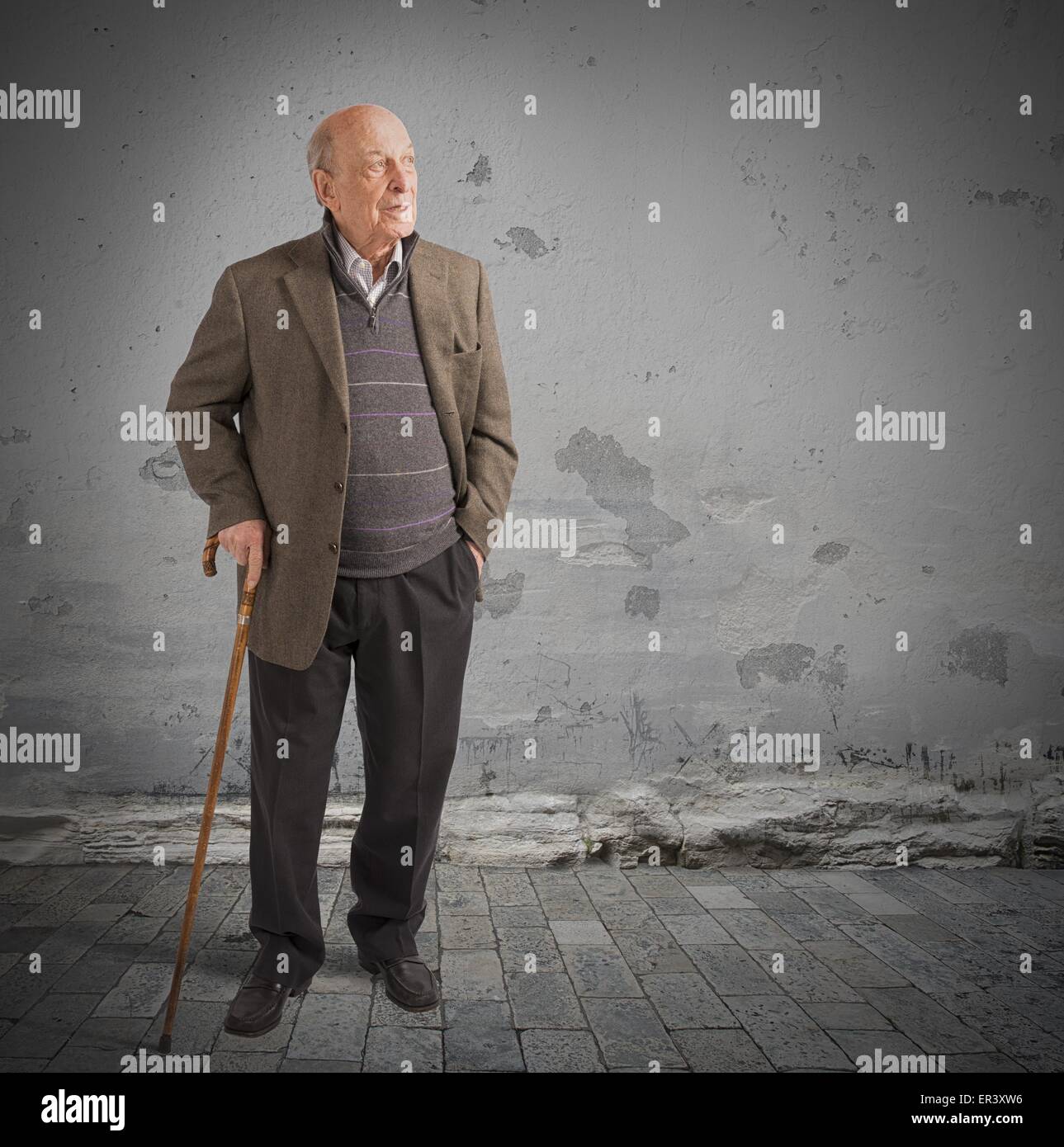 Elderly walking with stick Stock Photo - Alamy