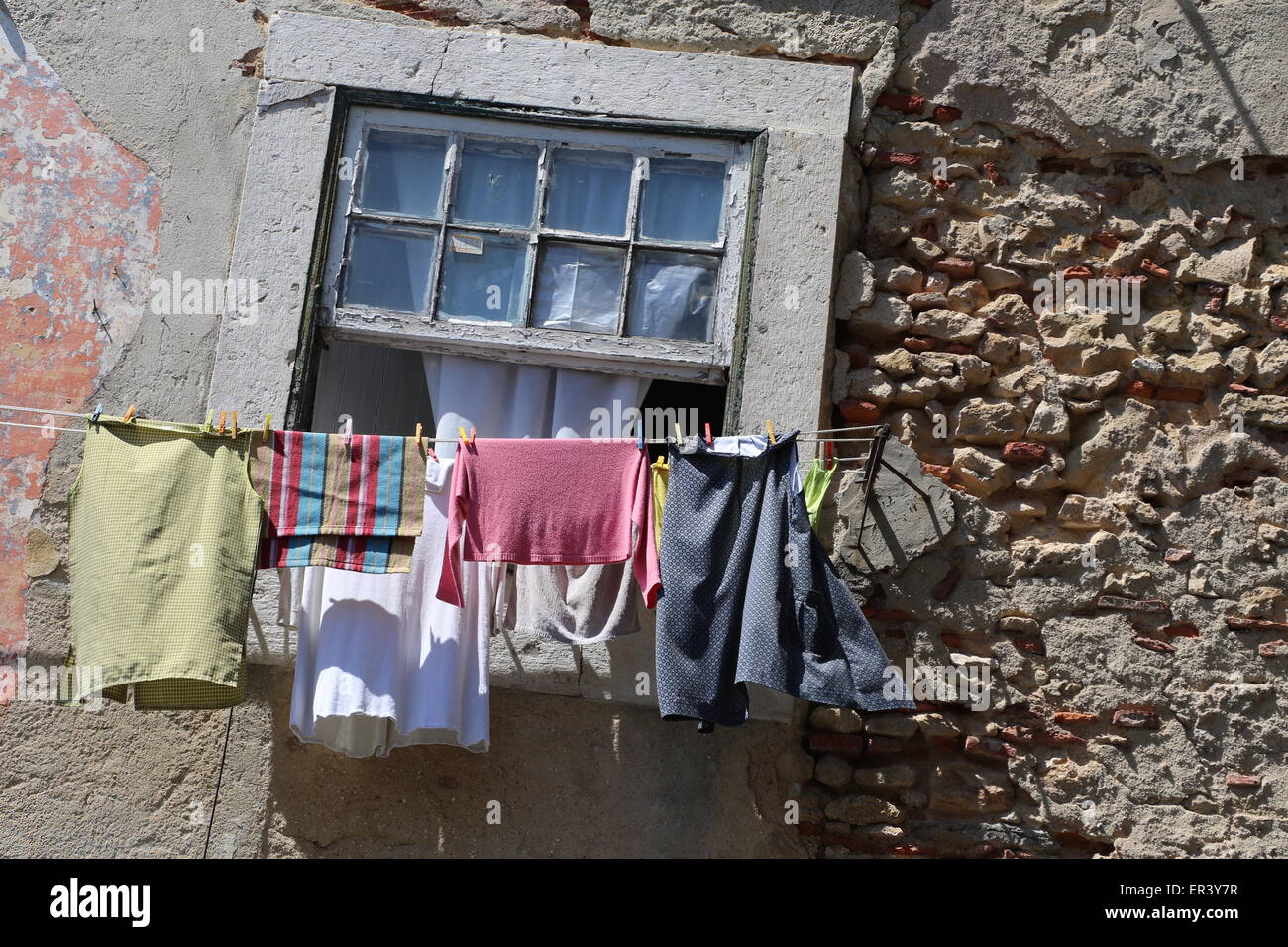 Laundry drying on a window in Lisbon, Portugal Stock Photo - Alamy