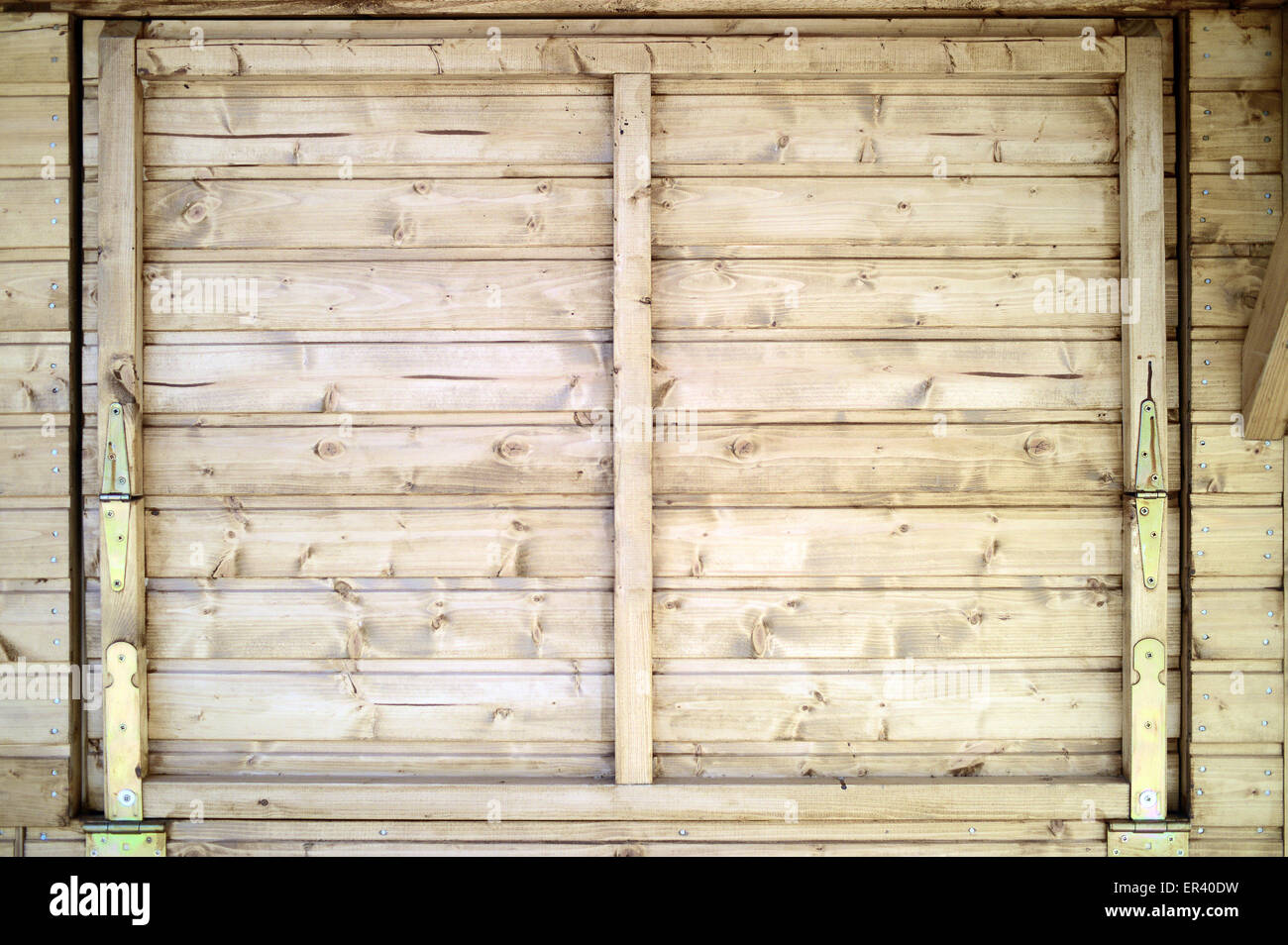 Exterior view of a closed wooden window of a cabin. Natural wood Stock ...