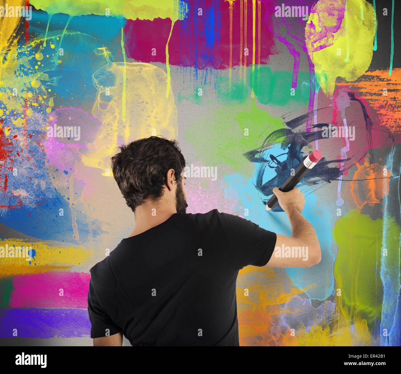 Boy colors a wall Stock Photo - Alamy