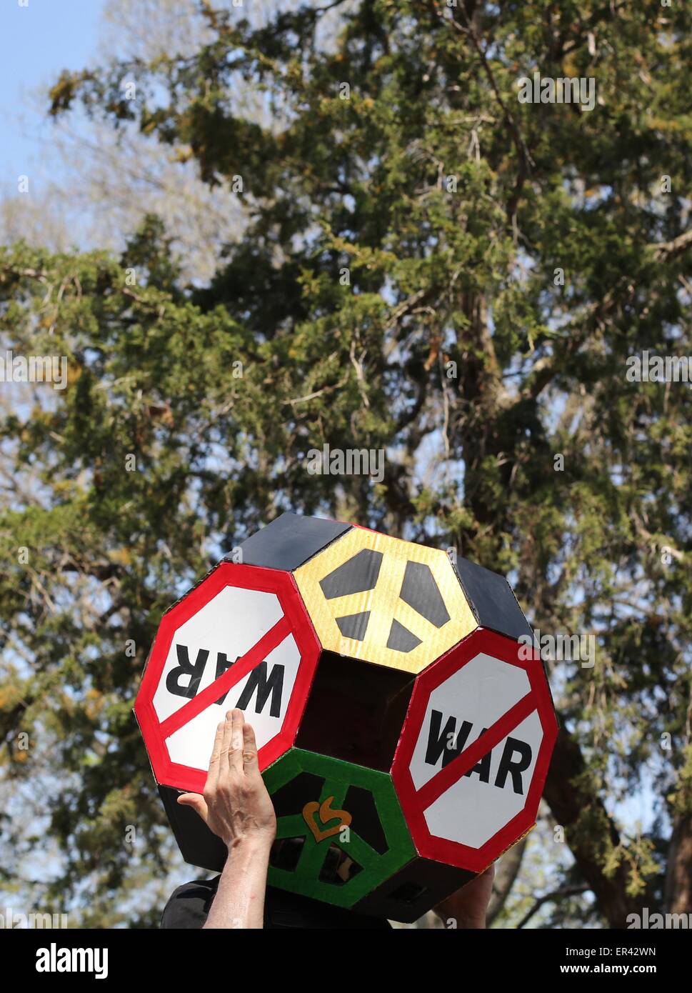 A person in a parade wearing an anti-war mask Stock Photo - Alamy