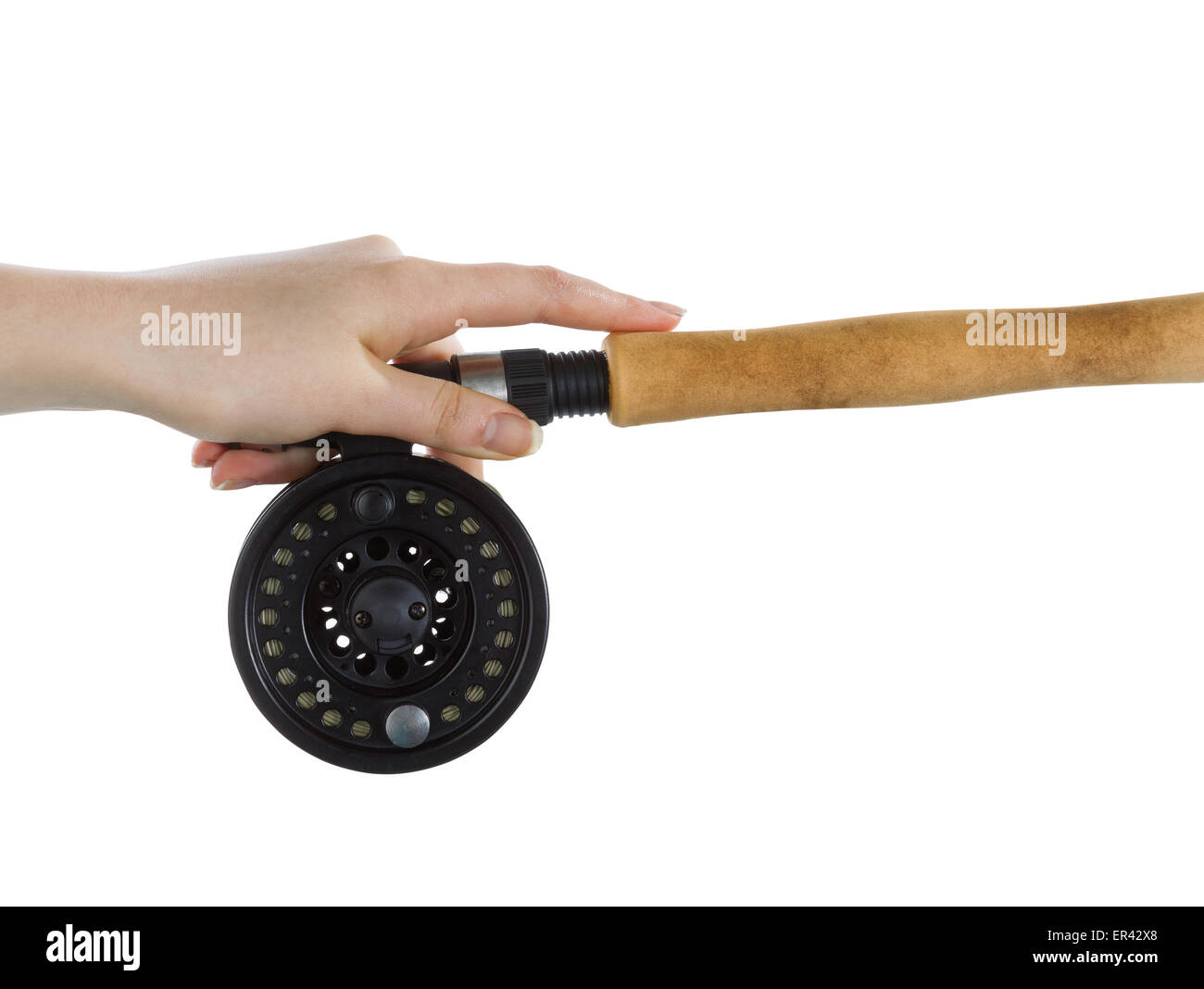 Close up of female hand holding fly fishing reel and rod. Isolated on ...