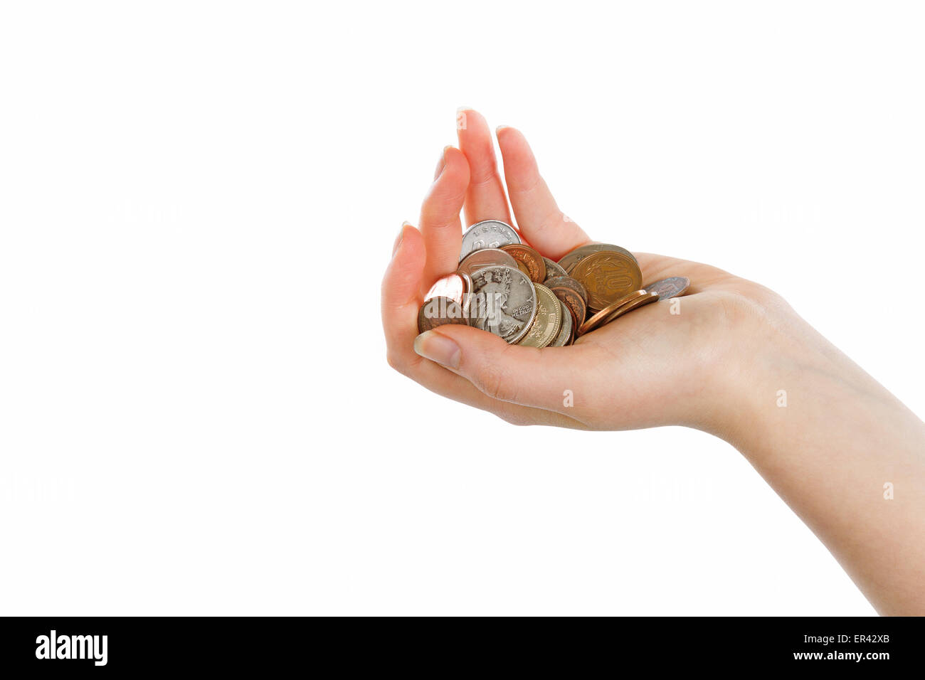 Open palm of female hand holding coins. Isolated on white background ...