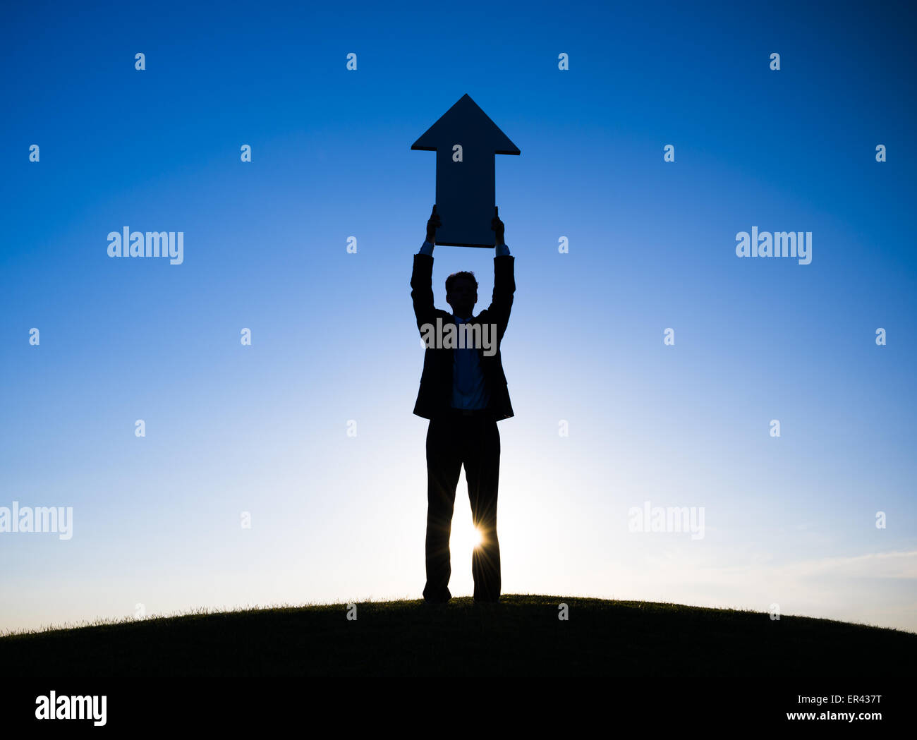 Man Holding Arrow Stock Photo - Alamy