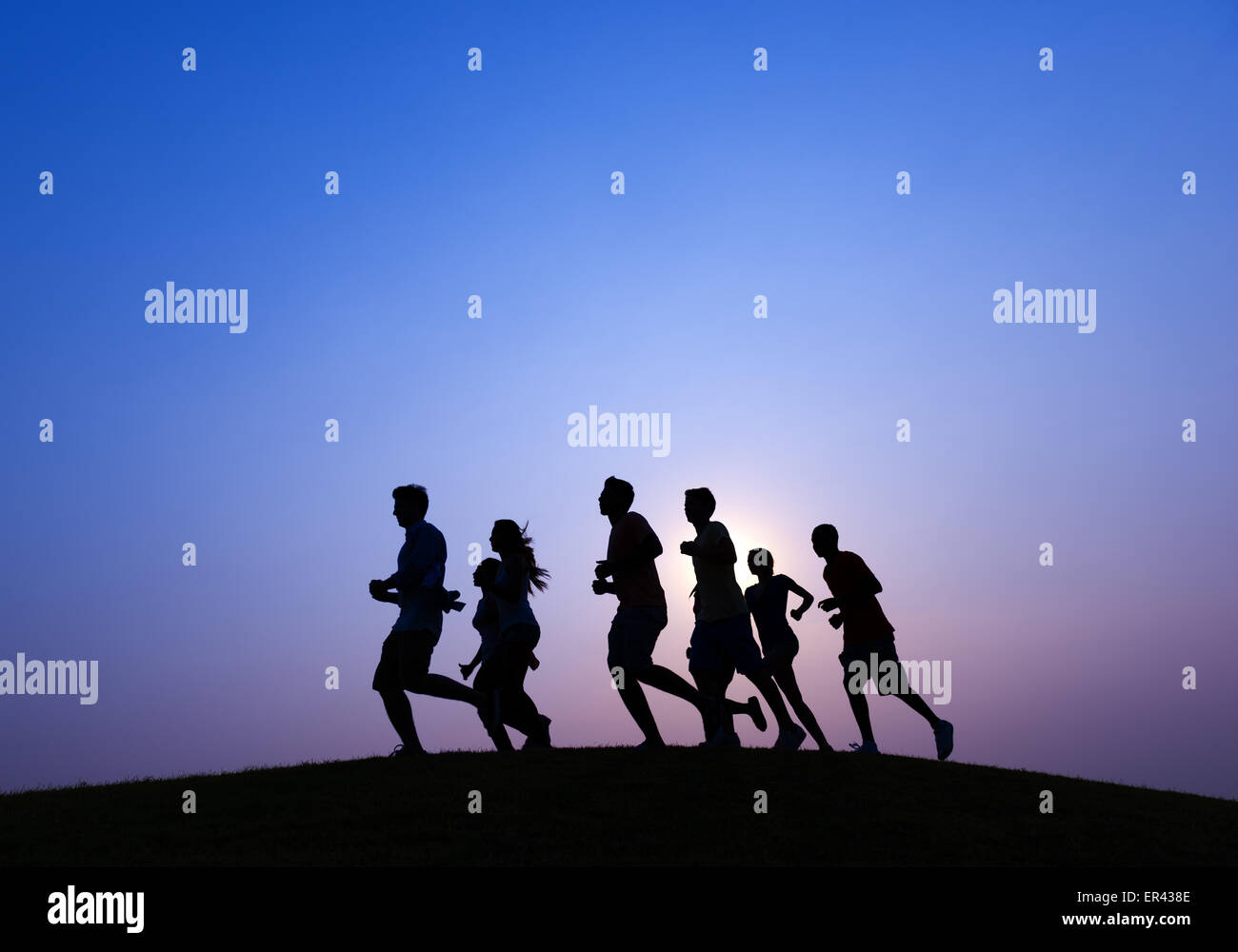Running at blue sunset Stock Photo - Alamy
