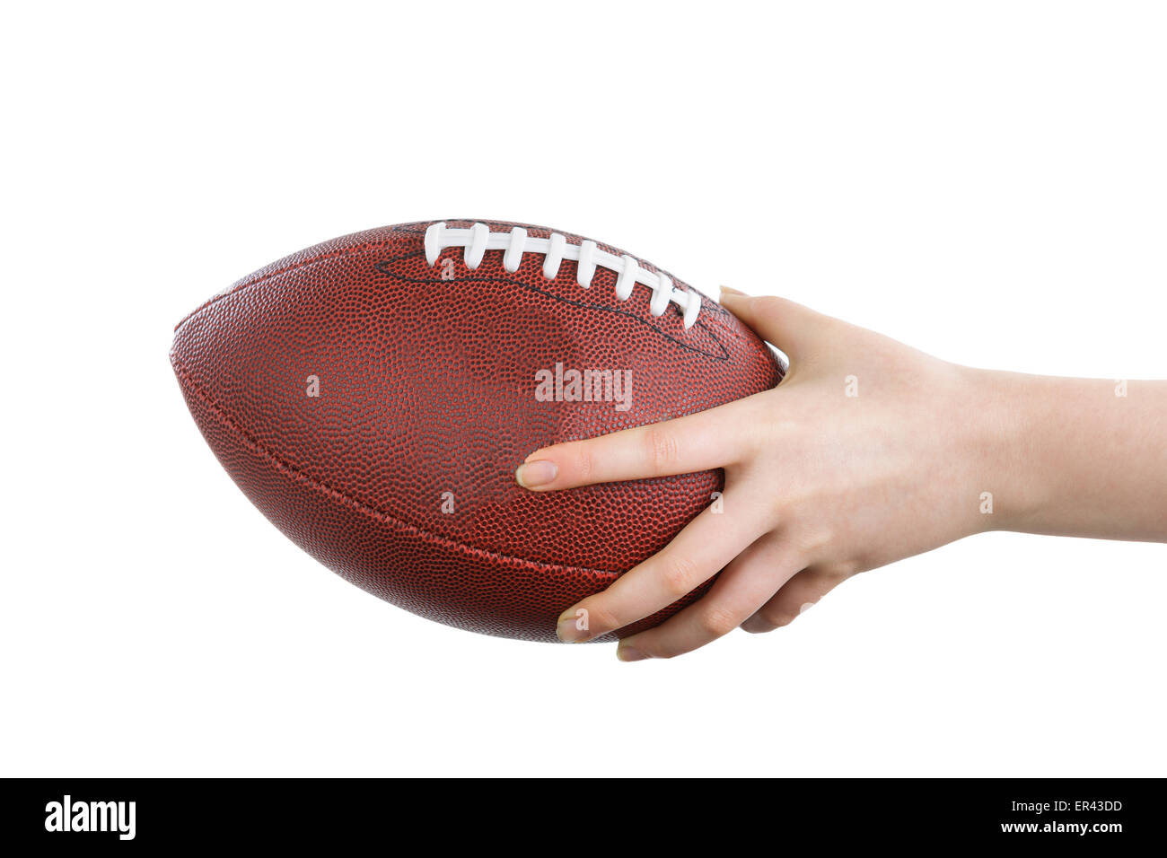Female hand holding American football on isolated white background ...