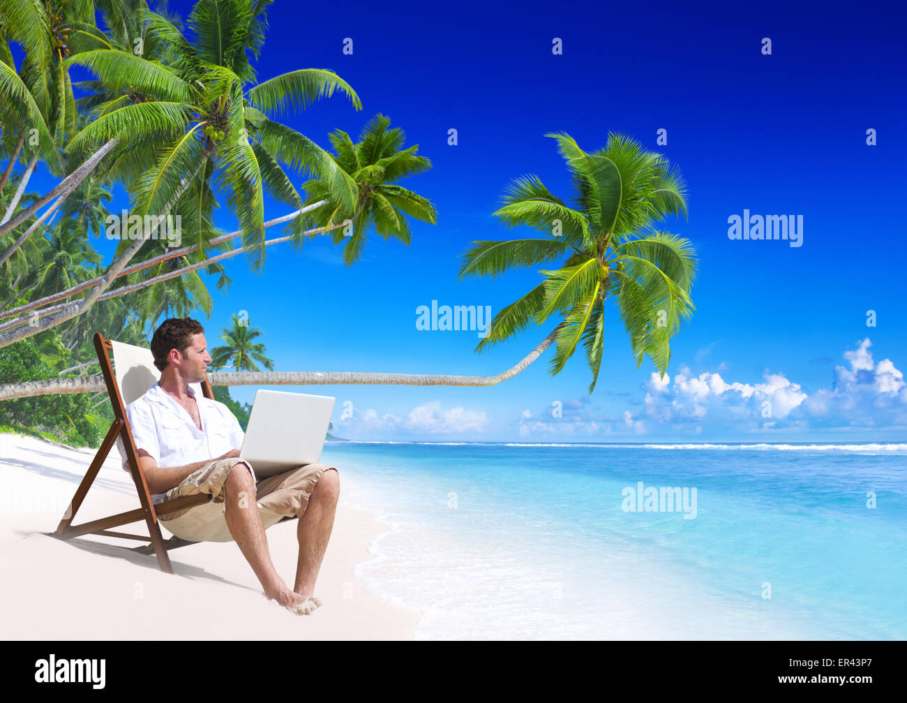 Man working on the beach Stock Photo - Alamy