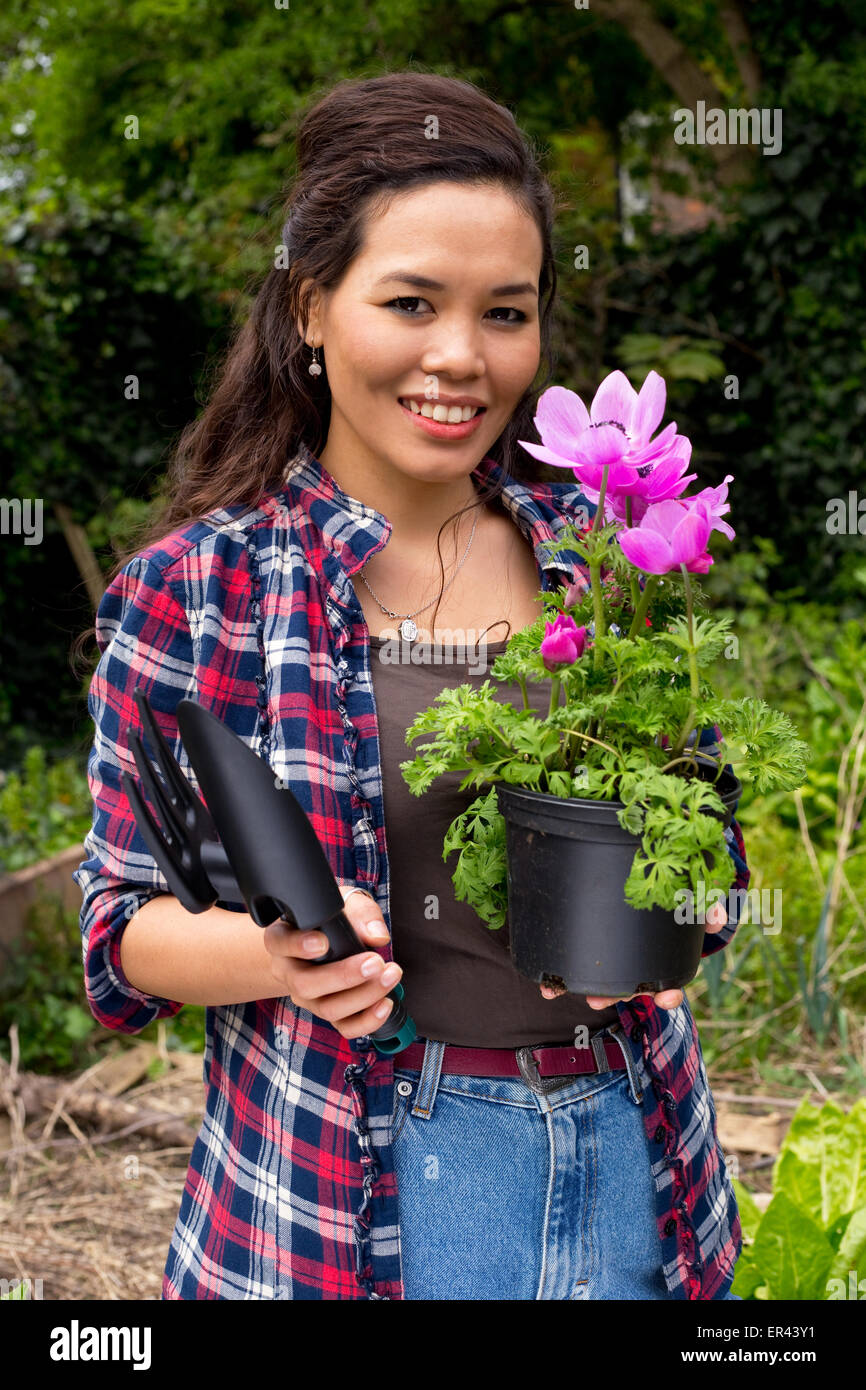 young woman in the garden Stock Photo - Alamy
