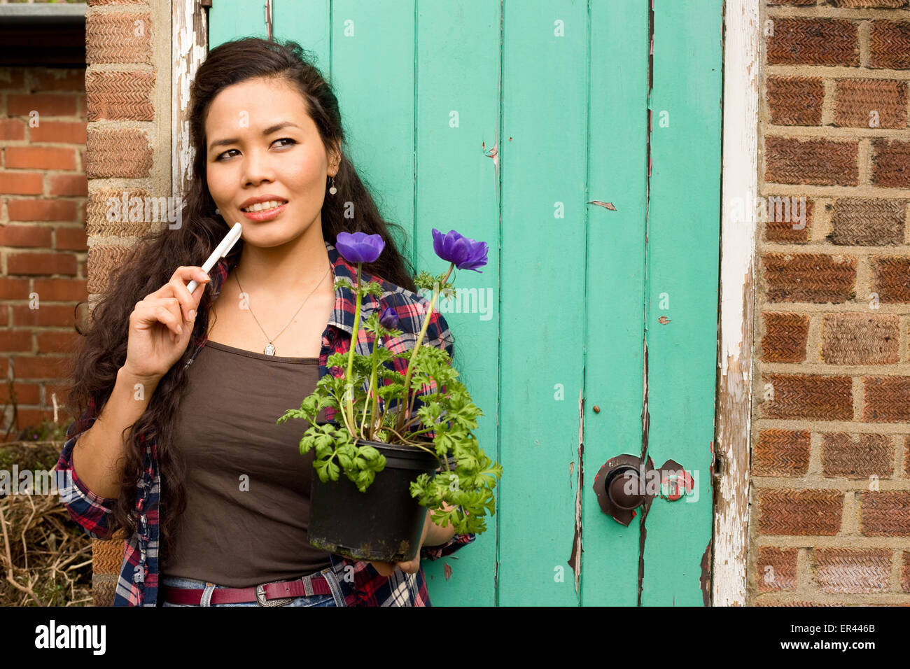 young woman thinking in the garden Stock Photo - Alamy