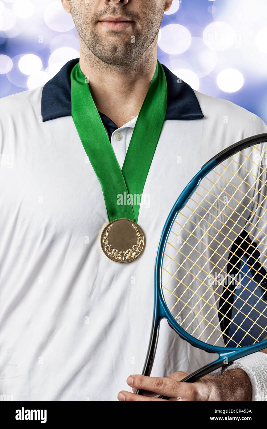 Tennis player celebrating with a gold medal, on a blue lights ...