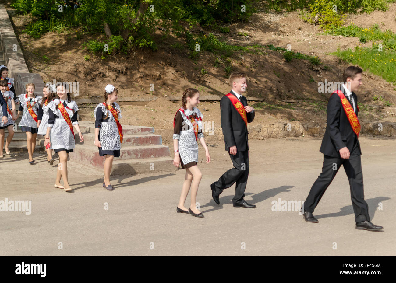 Group of Russian schoolchildren walking to a celebration after ...