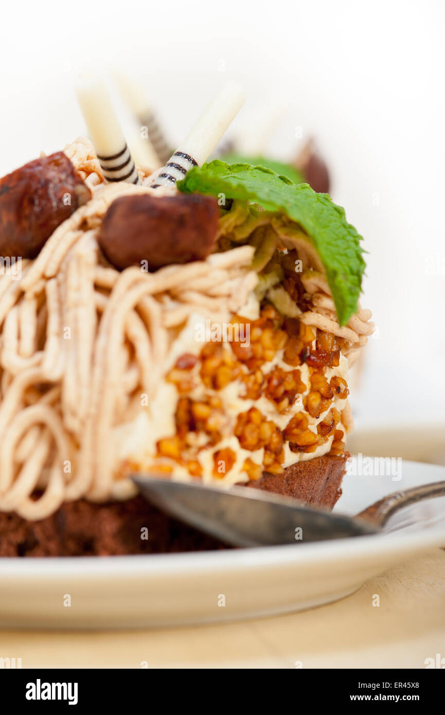 fresh baked chestnut cream cake dessert over rustic white wood table ...
