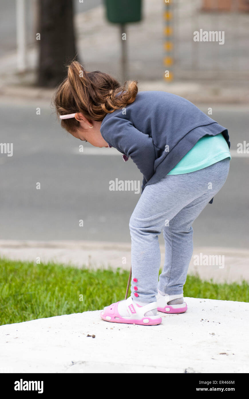 Young girl looking for something Stock Photo - Alamy