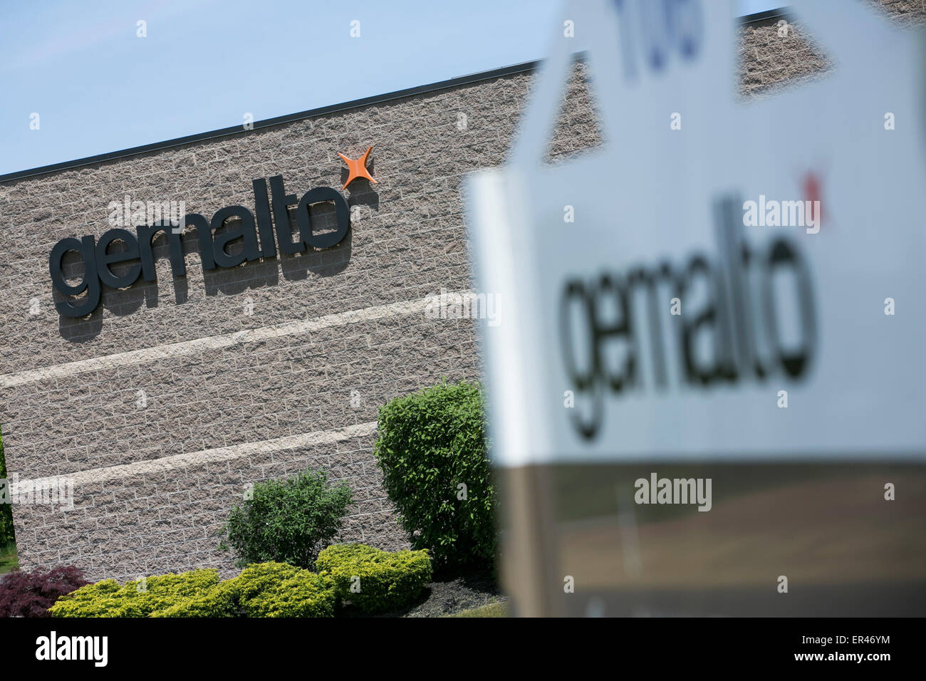 A logo sign outside of a facility operated by SIM card manufacturer ...