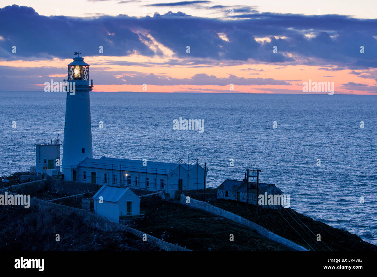 South Stack lighthouse at sunset Ynys Lawd Holy Island Anglesey North ...