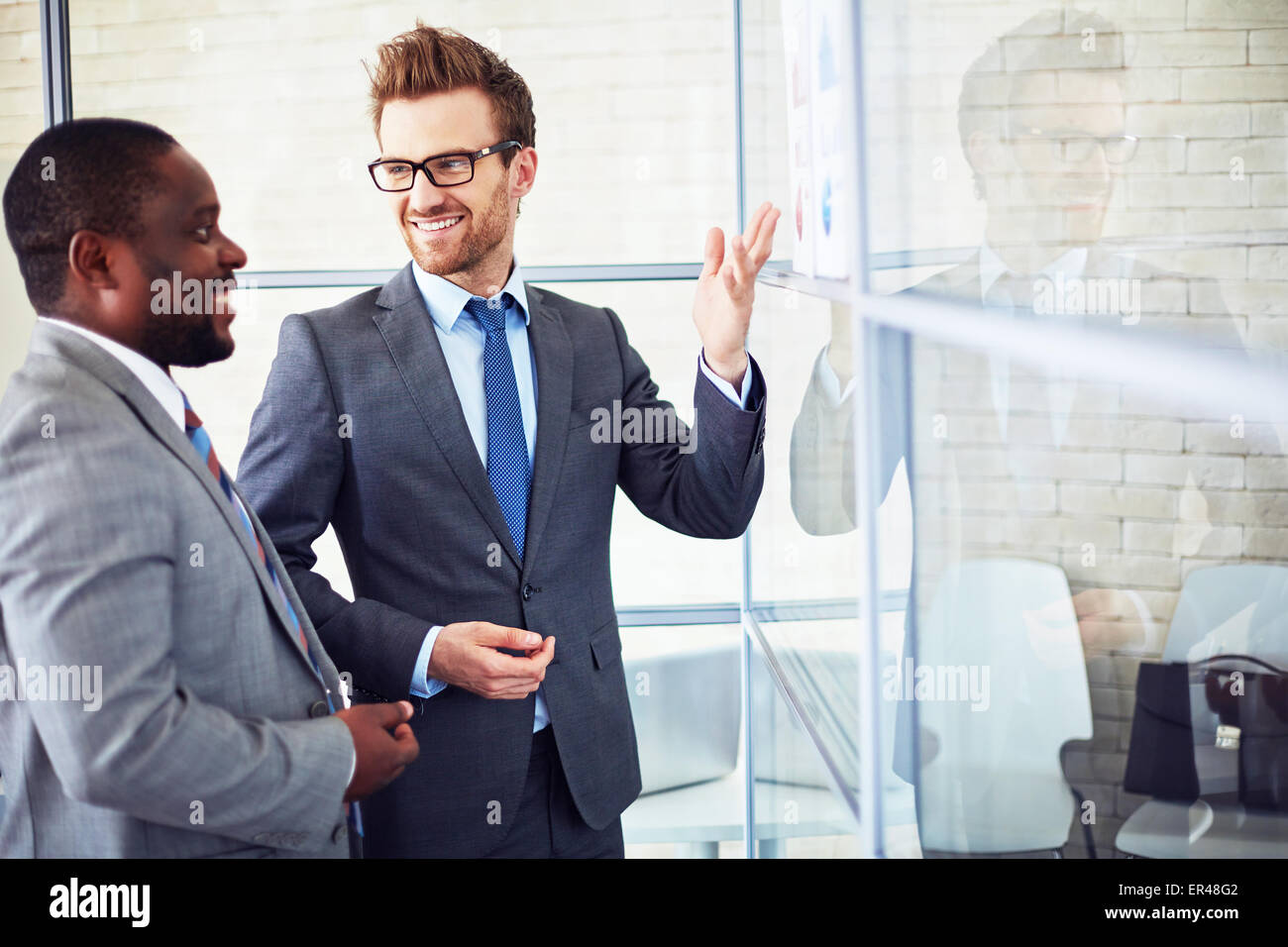 Two colleagues discussing business hi-res stock photography and images ...