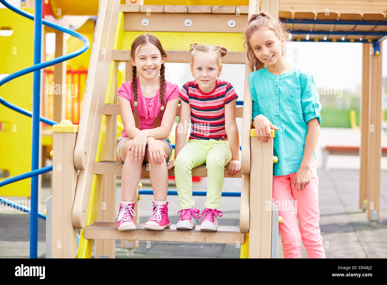 Active girls having fun on playground Stock Photo - Alamy