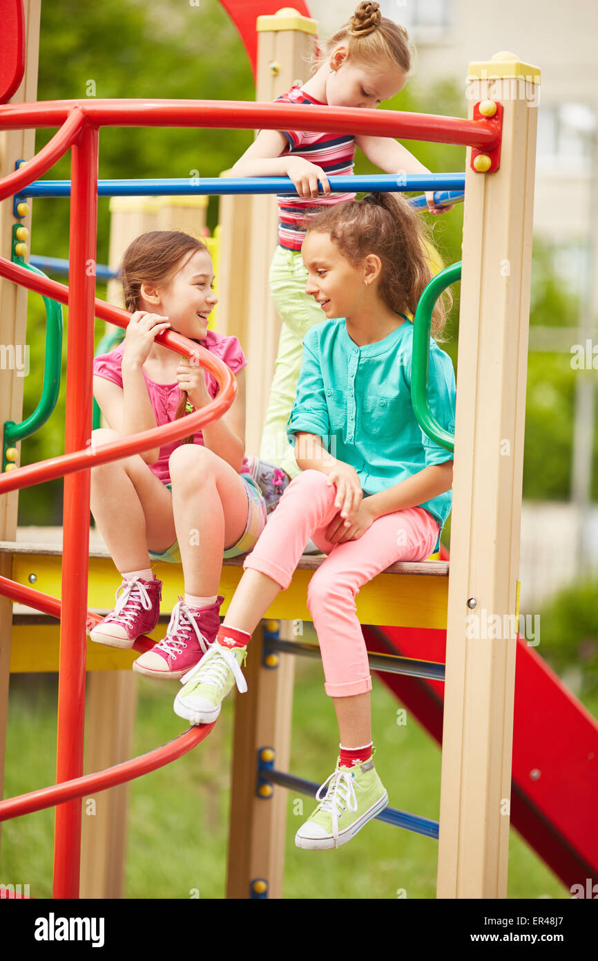Friendly kids having fun on playground Stock Photo - Alamy